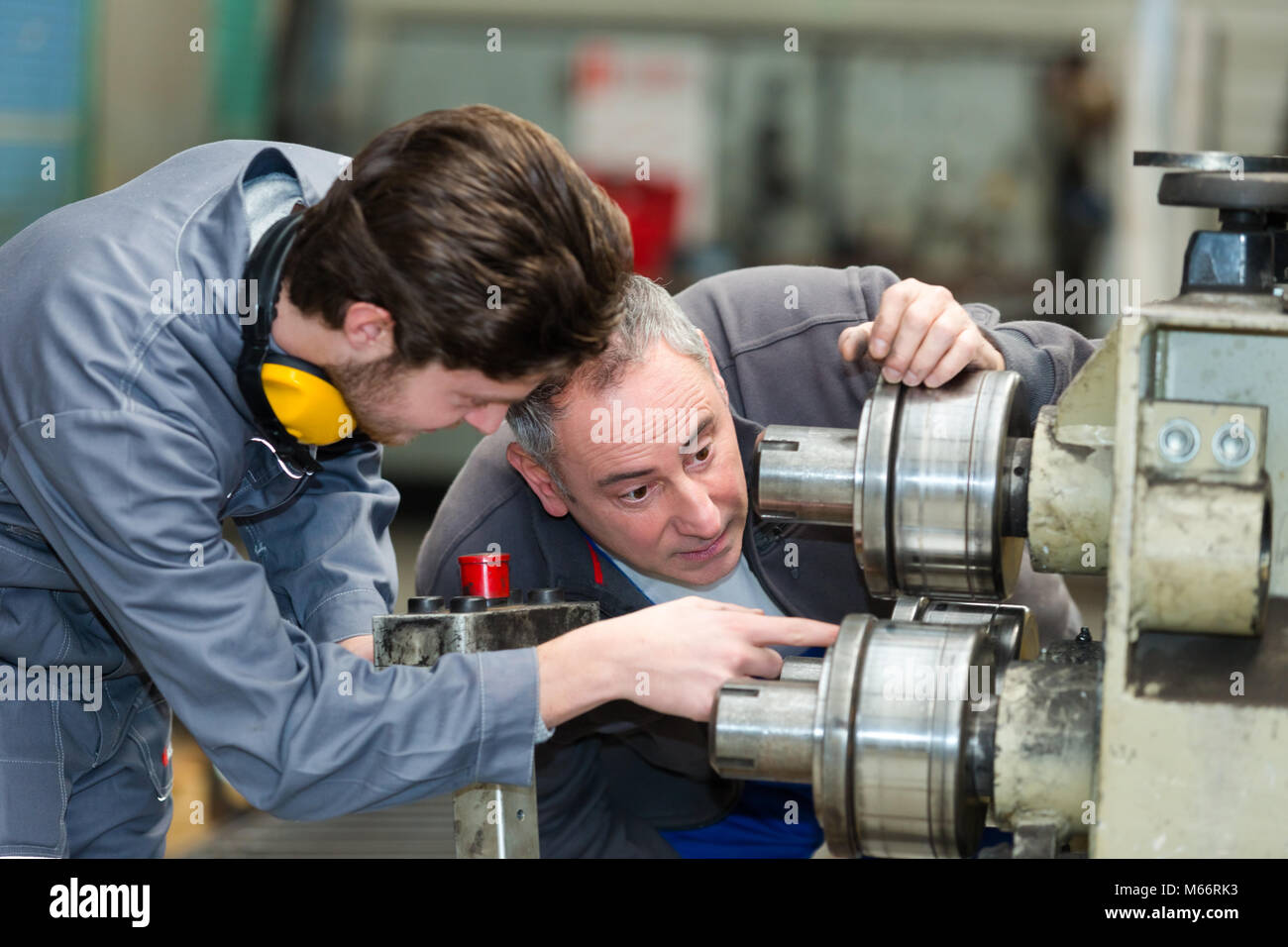 young machinist and his teacher Stock Photo - Alamy
