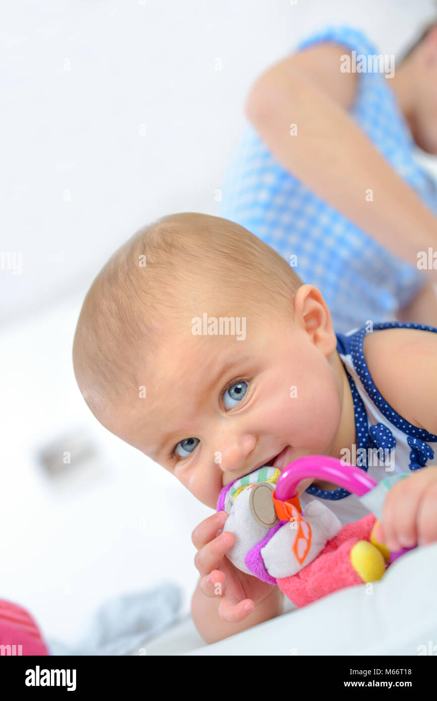 baby chewing a toy Stock Photo - Alamy