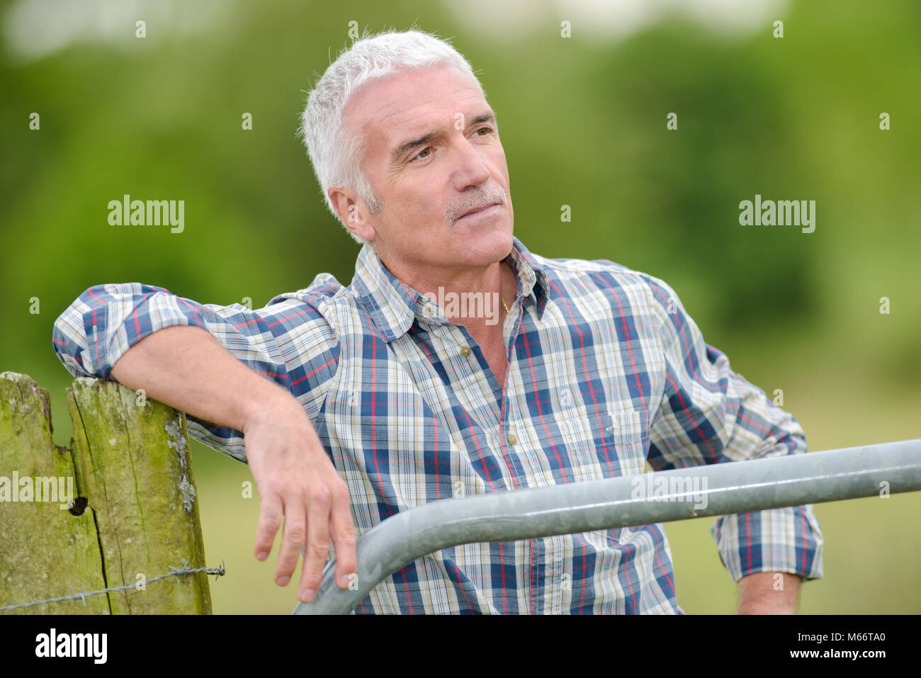 Farmer leaning on fence hi-res stock photography and images - Alamy
