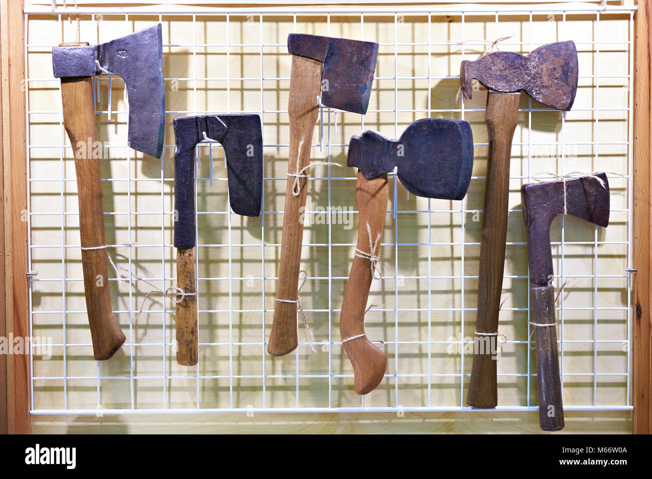 Old axes in the window of a vintage antique store Stock Photo - Alamy