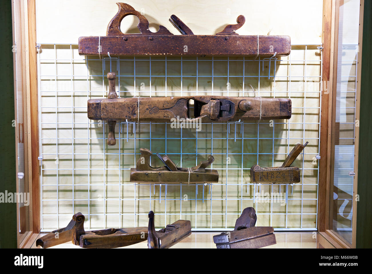 Old carpenter's planes in the window of a vintage antique store Stock ...