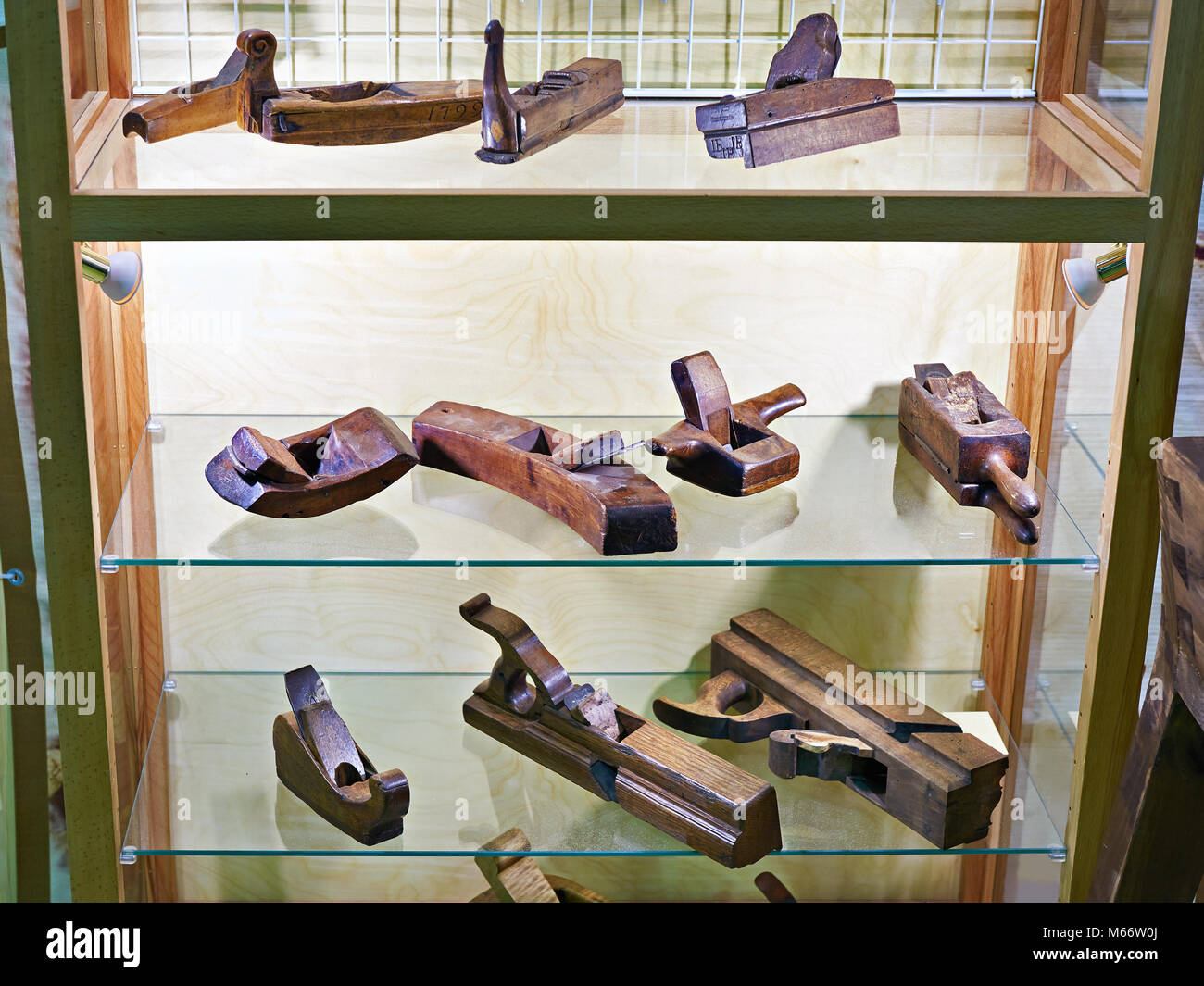 Old carpenter's planes in the window of a vintage antique store Stock ...