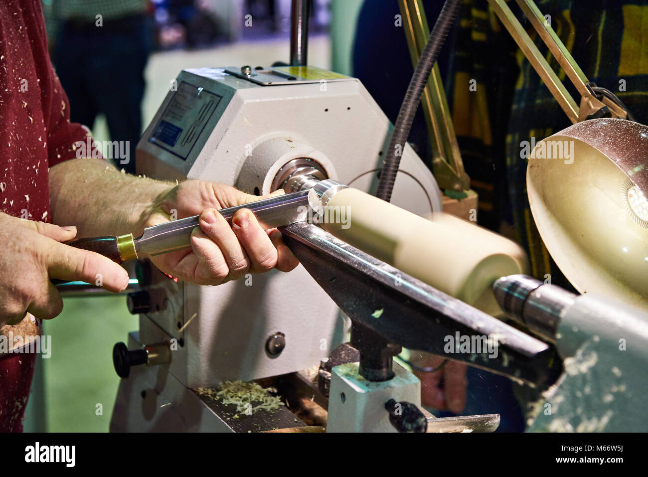 Processing of wooden parts on a lathe Stock Photo - Alamy