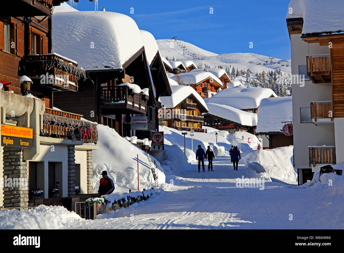 Village road with snow-covered chalets, Bettmeralp, Aletsch area, Upper ...