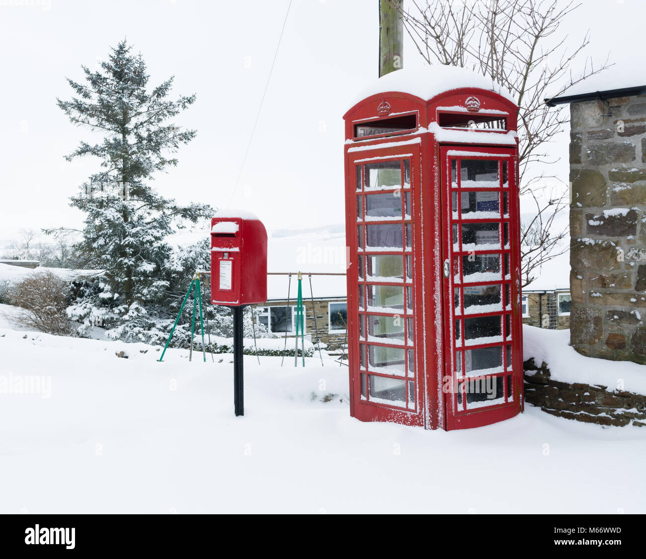 Red phone box and pillar box in the snow Stock Photo - Alamy