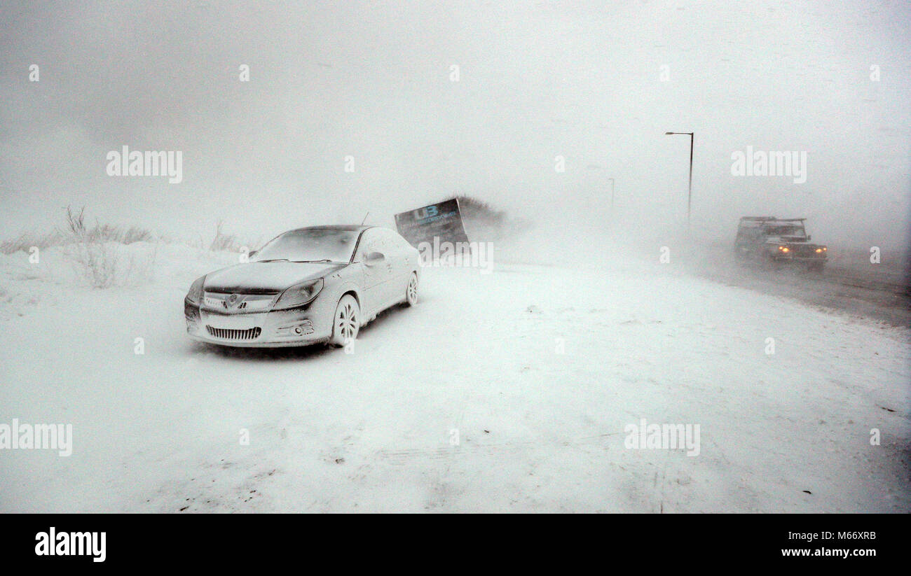 A stranded car covered in snow in Whitley Bay in Tyne and Wear as storm ...
