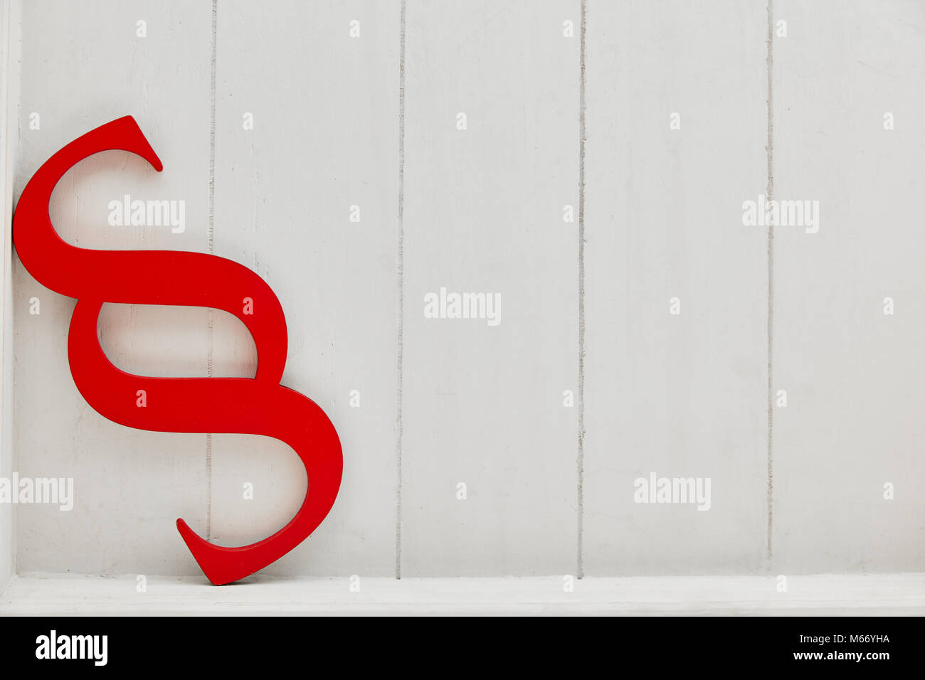 Red Paragraph sign as a law background with light wood Stock Photo - Alamy