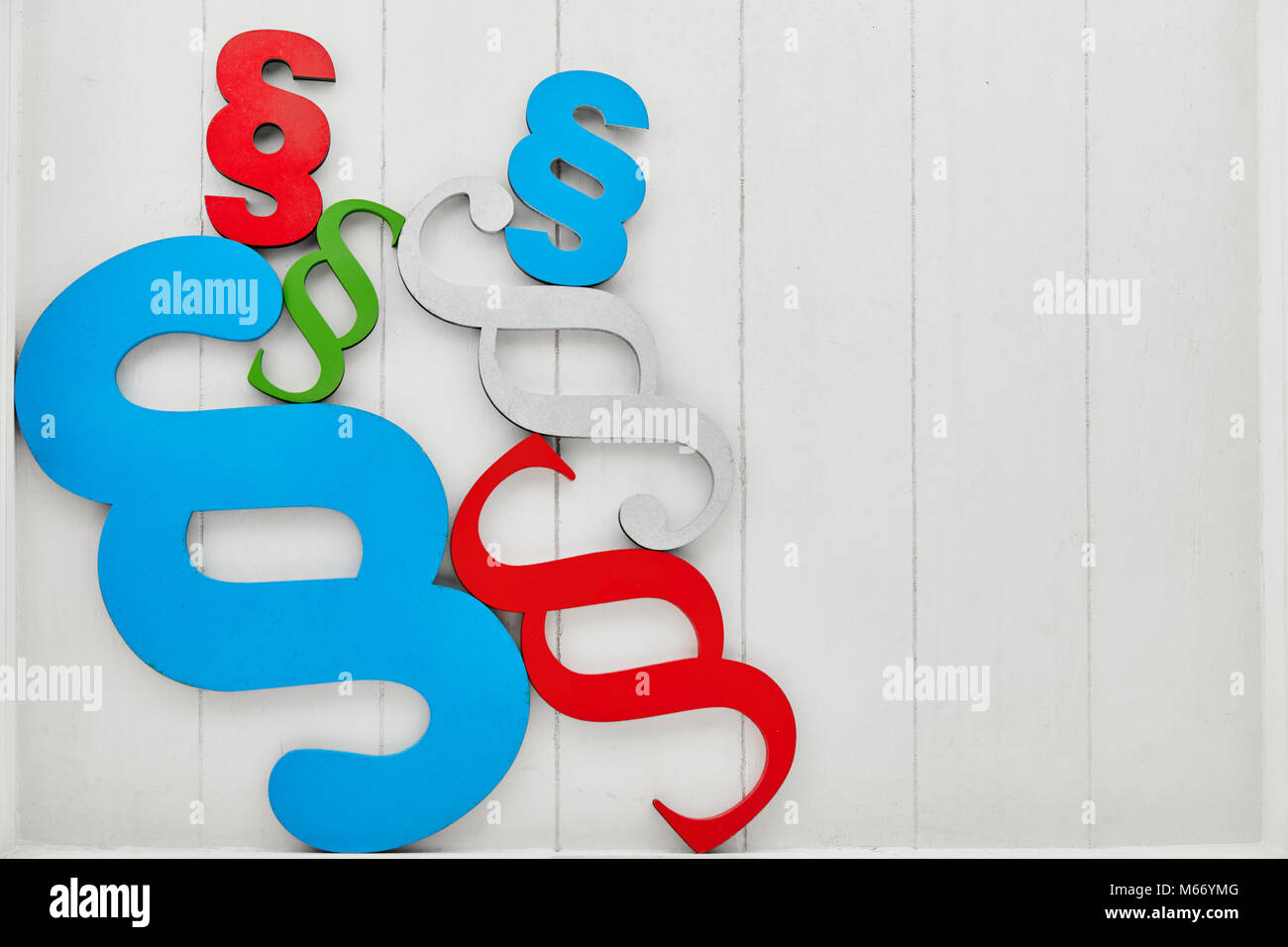 Many colorful paragraphs as a justice symbol in front of a wood ...