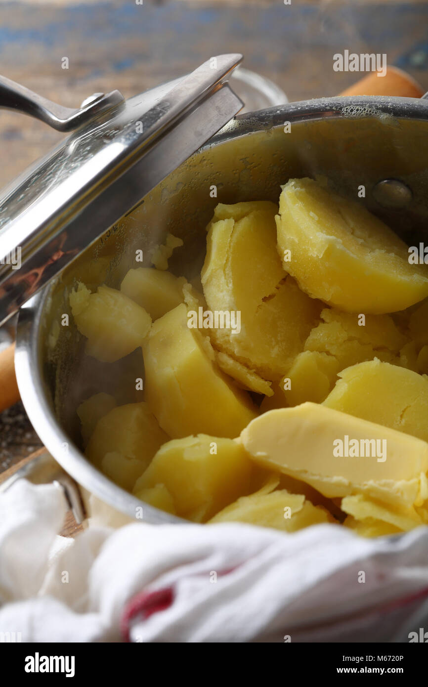 Hot potato in pot, cooking food Stock Photo - Alamy