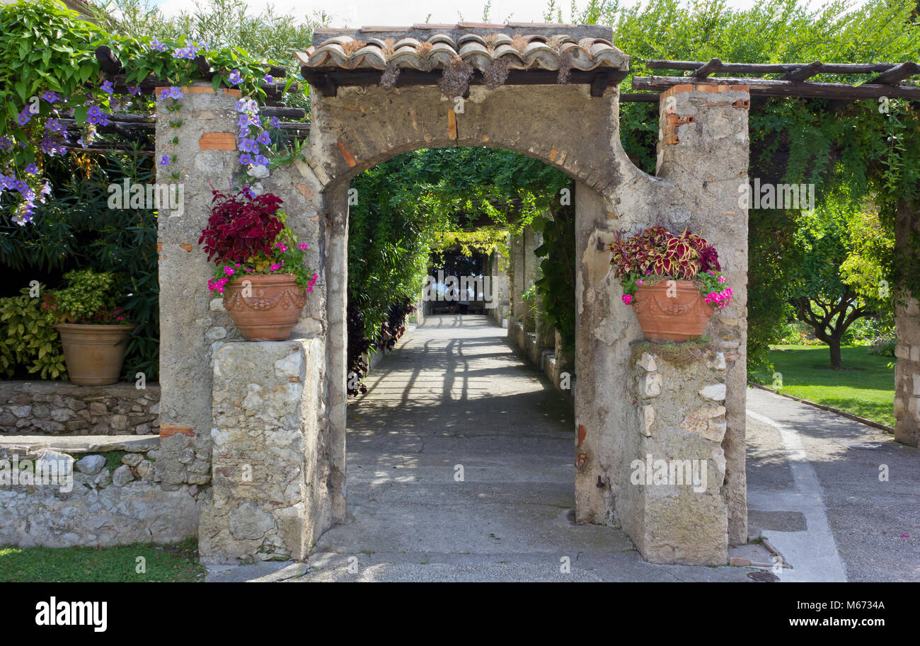 Arched arbored passage in a beautiful garden Stock Photo - Alamy