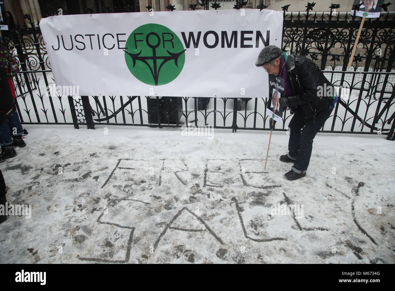 Members of Justice for Women protesting outside the Royal Courts of ...