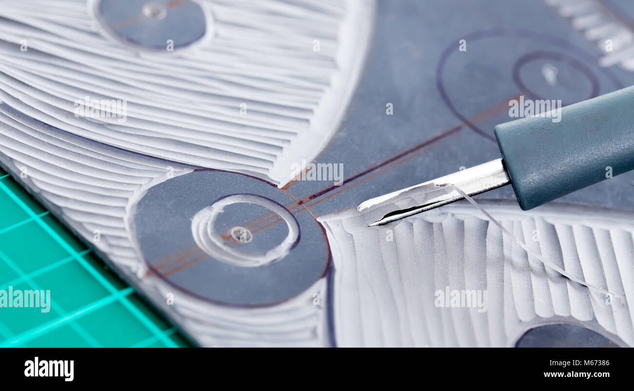 Lino cutting close up. Lino being cut by hand Stock Photo - Alamy