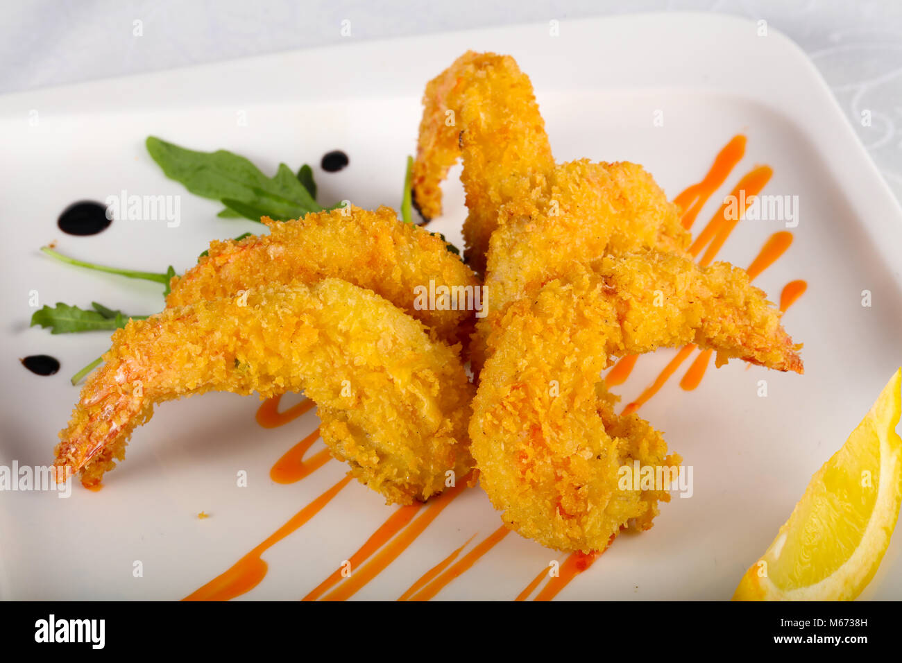 Crispy prawns served lemon slice Stock Photo - Alamy