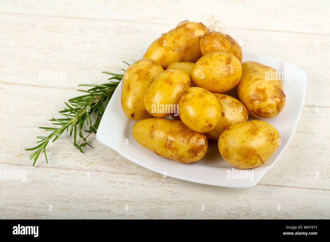 Raw young potato with herbs Stock Photo - Alamy