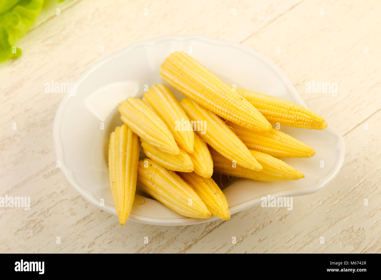 Young raw baby corn Stock Photo - Alamy