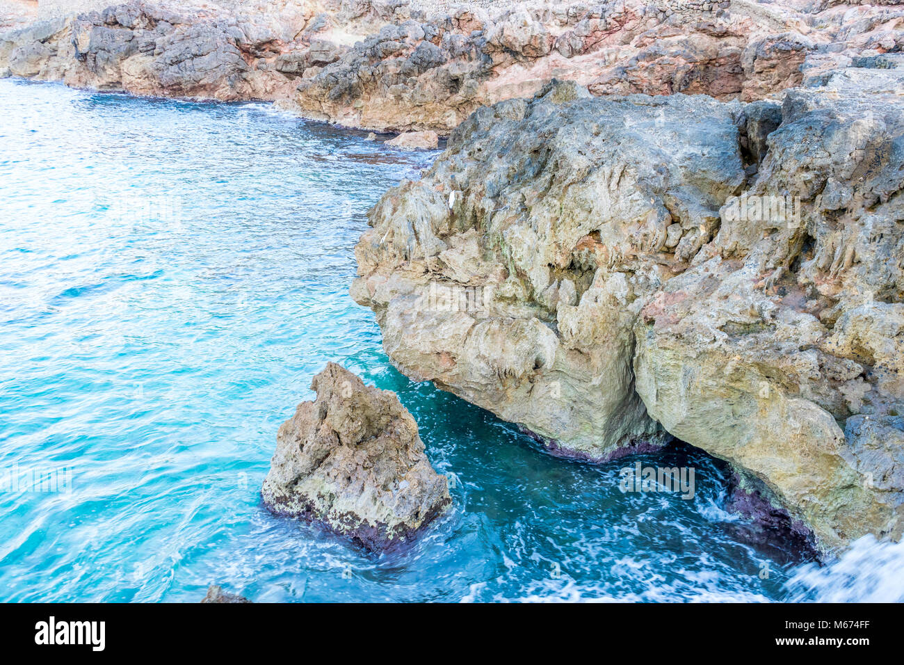 Cliff, Rocks by the sea with waves of the Mediterranean sea next to the ...