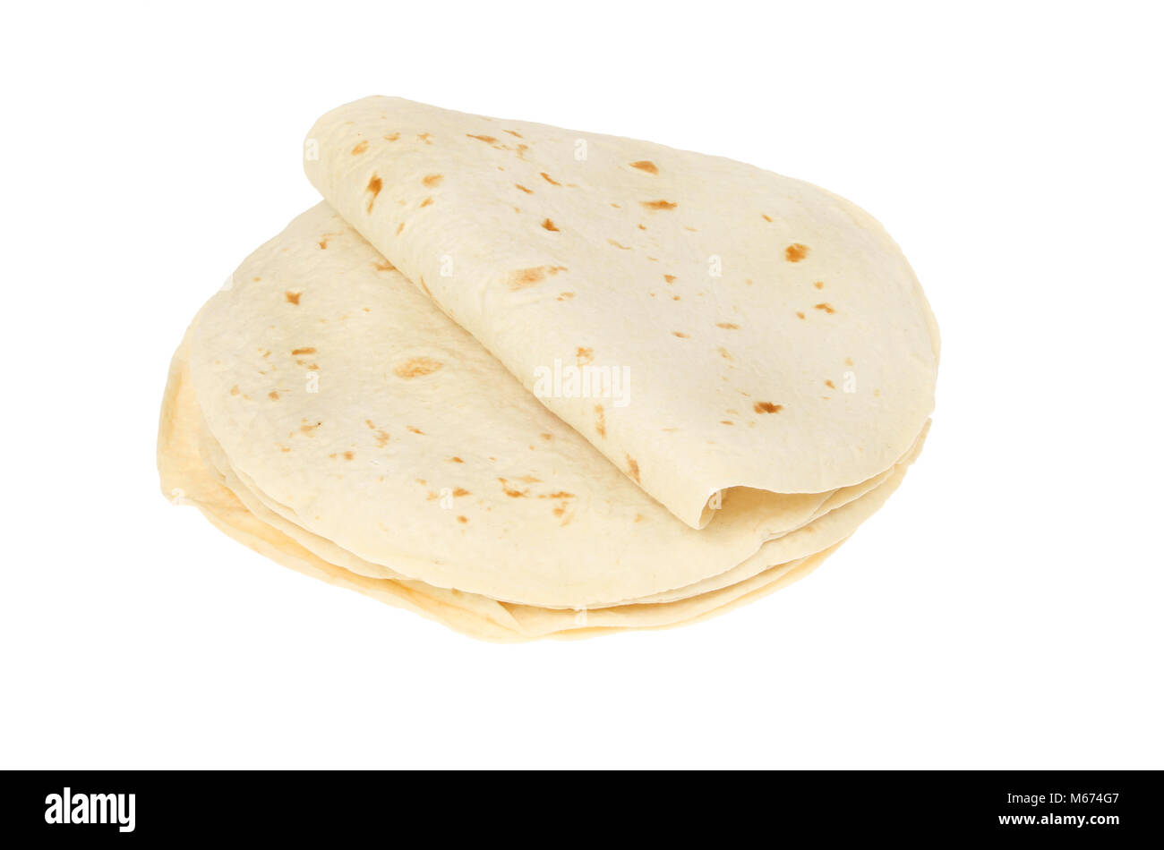 Stack of flour tortillas isolated against white Stock Photo - Alamy