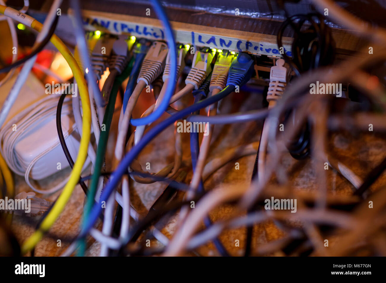 Hamburg, Germany. 29th Dec, 2015. Network cables and a router pictured ...