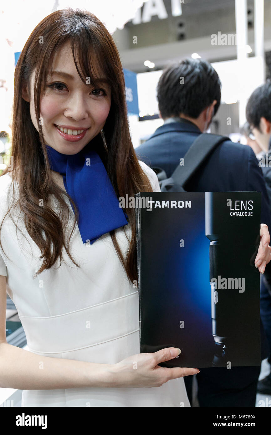 Yokohama, Japan. 1st Mar, 2018. A booth assistant poses for a ...
