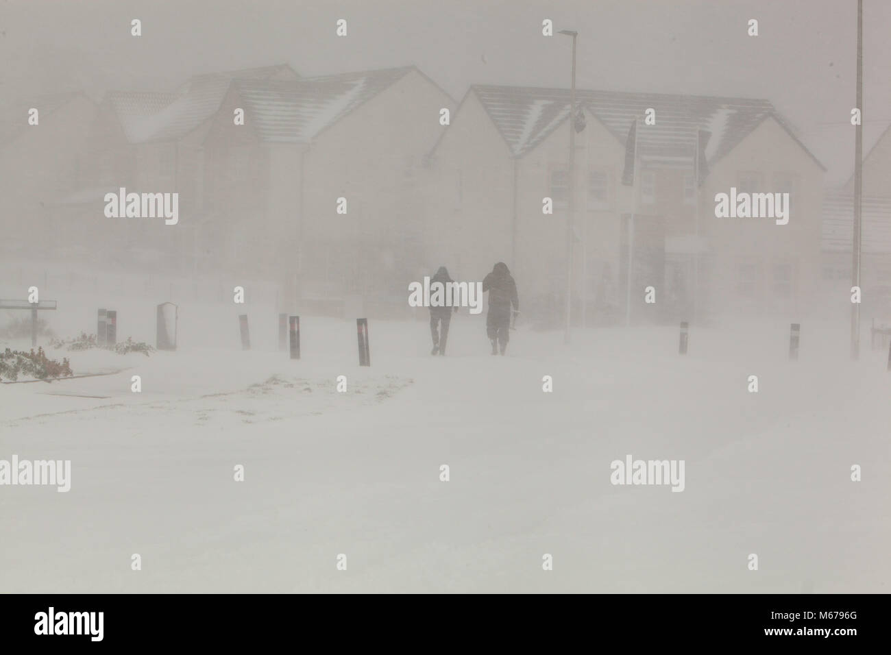 Larbert area, Central Scotland. 1st March 2018. Pedestrians head home ...