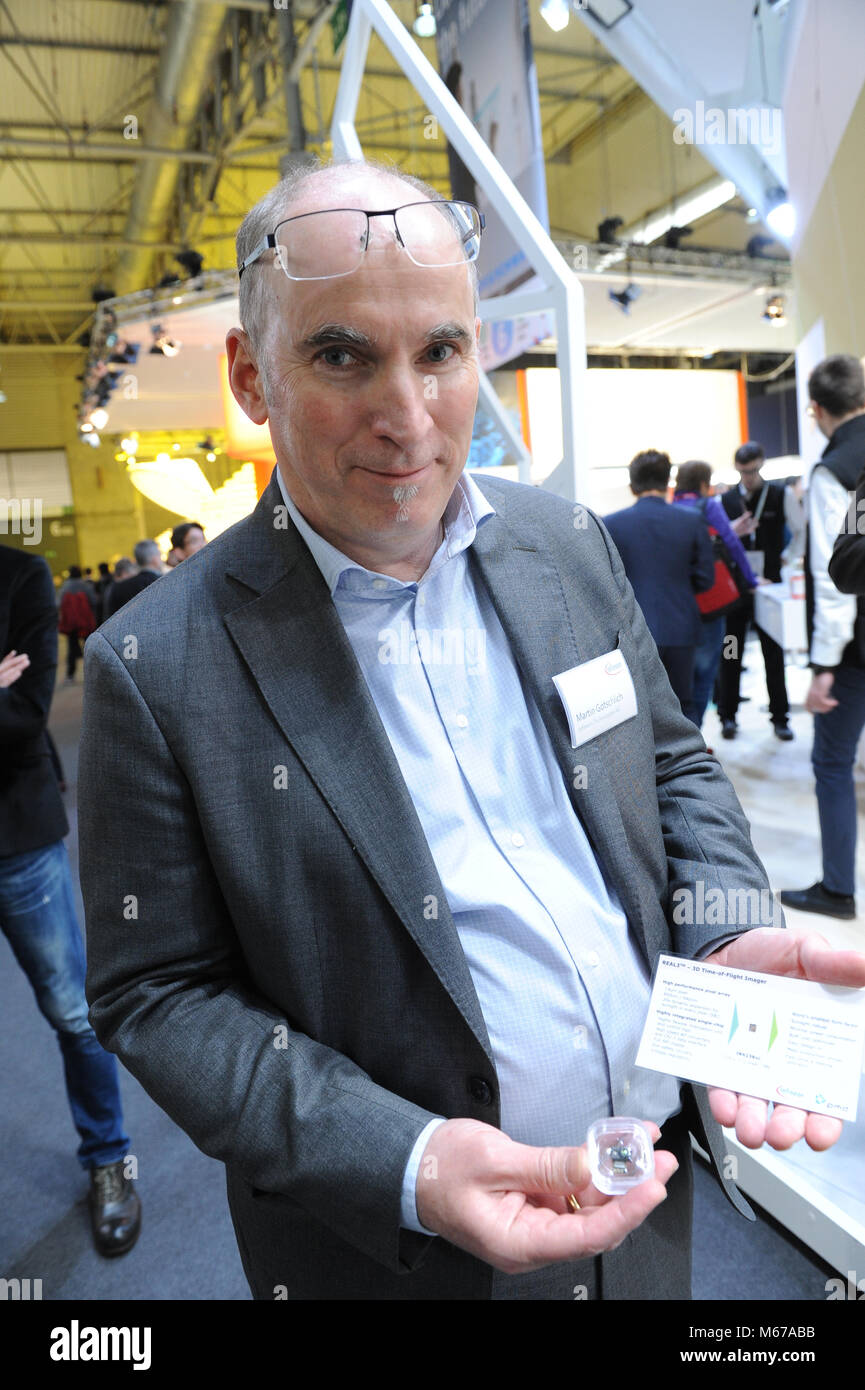 Infineon manager Martin Gotschlich demonstrating a prototype of a face ...