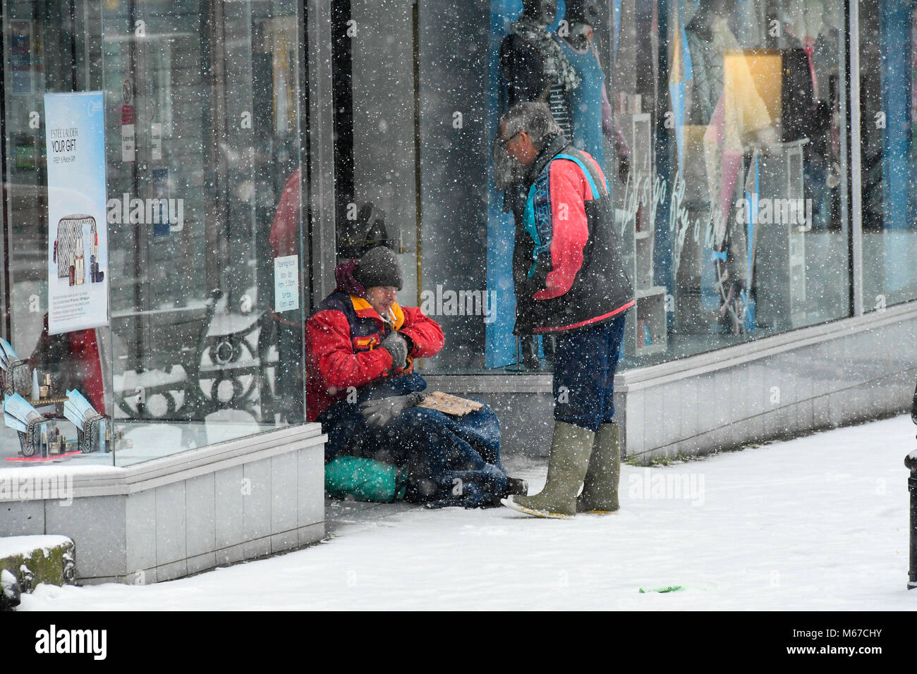 Dorchester, Dorset, UK. 1st Mar, 2018. UK Weather. A homeless man being ...