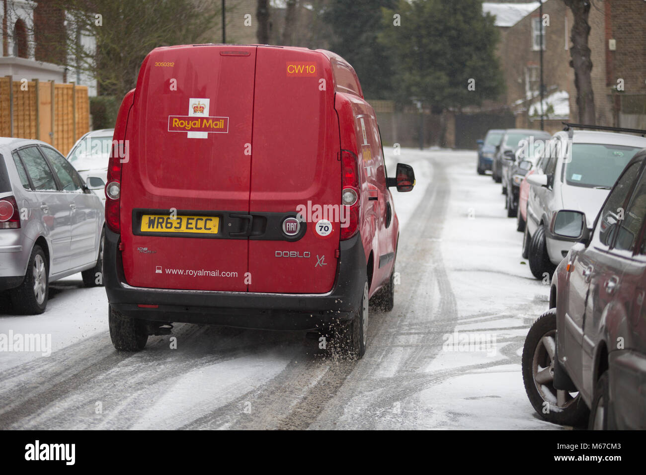 London, UK 1st March 2018: A Royal Mail van drives down a slippery ...