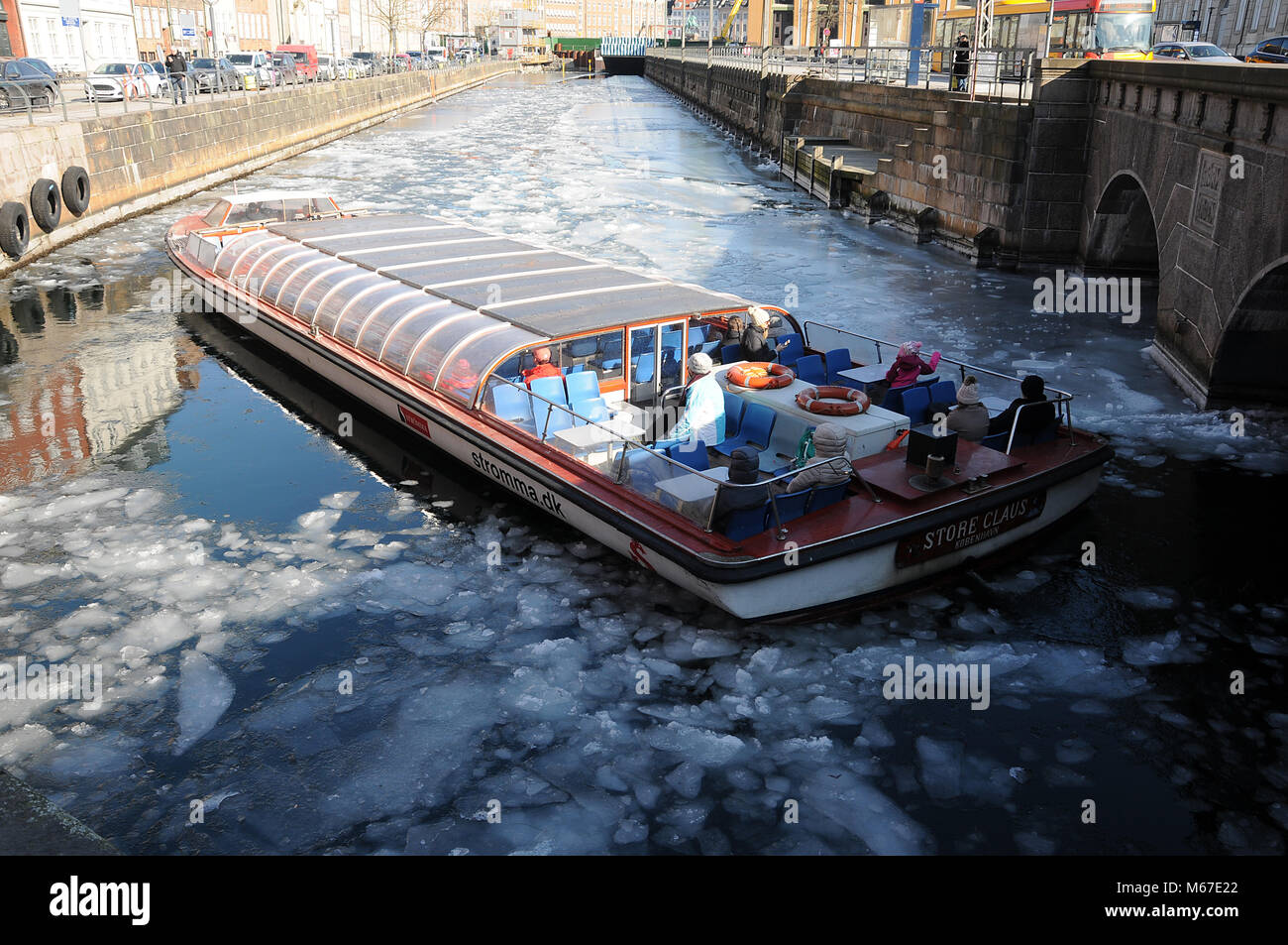 Copenhagen / Denmark, 01.March 2018 Tourists boat crusing in cold and ...