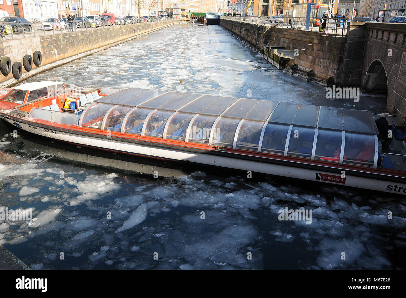 Copenhagen / Denmark, 01.March 2018 Tourists boat crusing in cold and ...