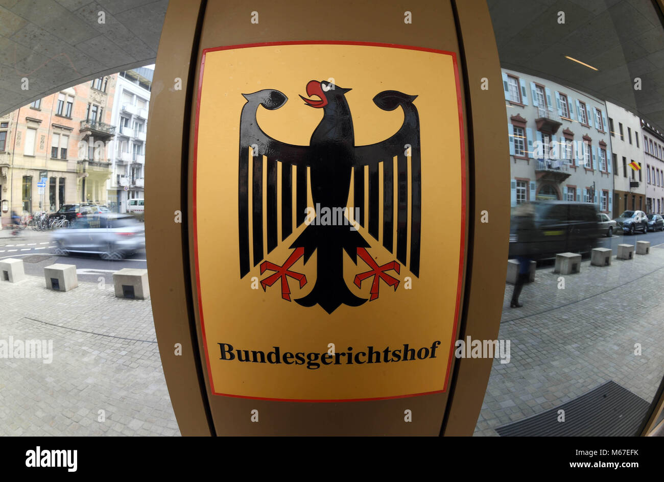 01 March 2018, Germany, Karlsruhe: a sign with the federal eagle and ...