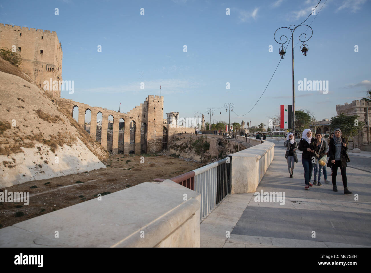 Aleppo, Syria. 2nd Nov, 2017. A family of girls walk by Aleppo's famous ...