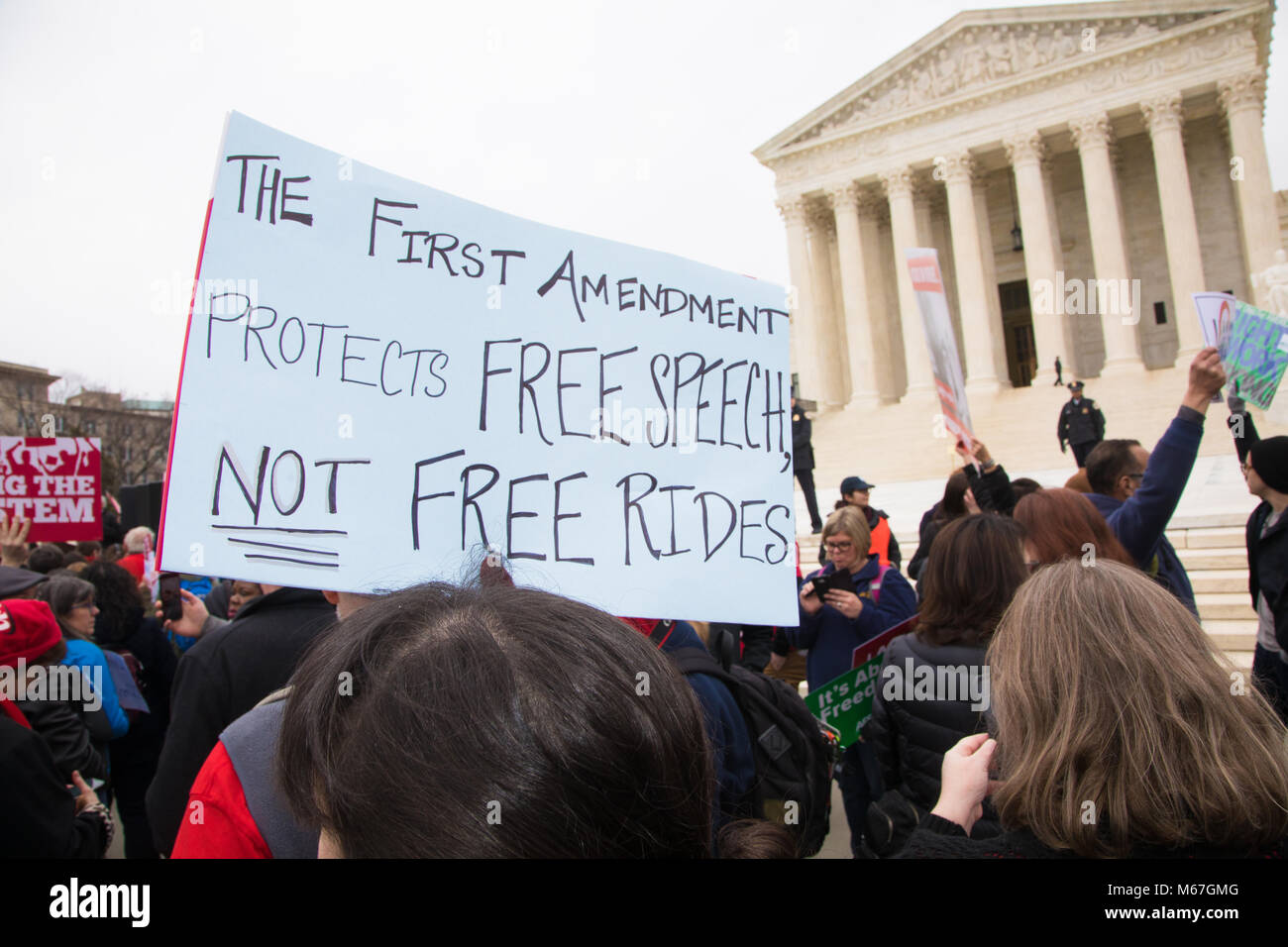 "The First Amendment protects free speech, not free rides" reads the ...