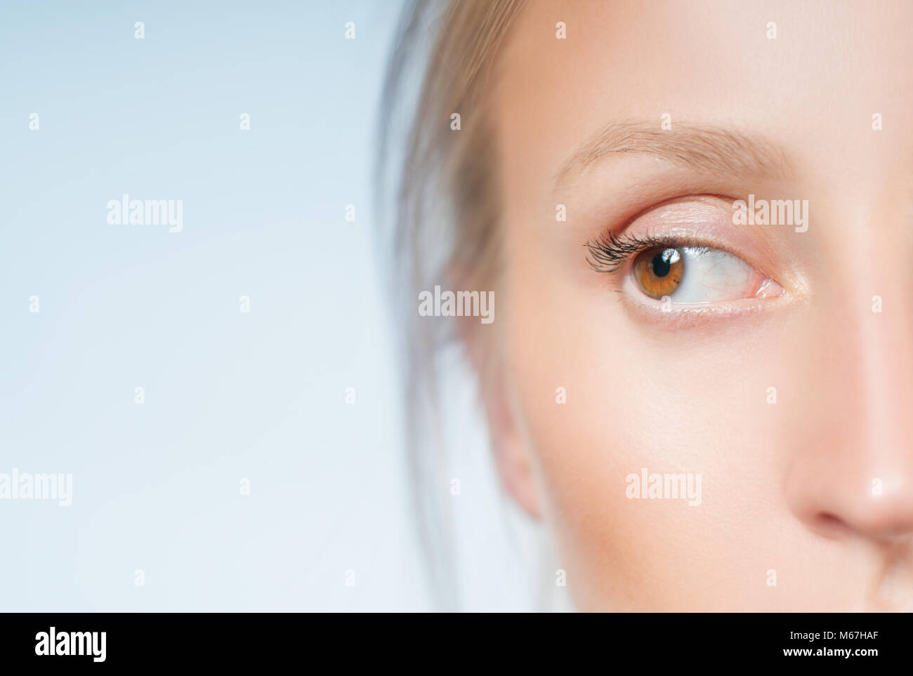 Eyes. Half face. Closeup of beautiful female brown eye Stock Photo - Alamy