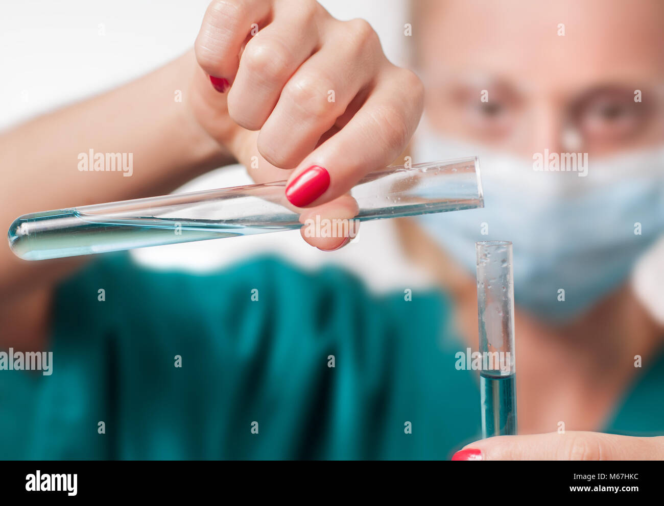 Female doctor doing chemical tests in laboratory Stock Photo - Alamy