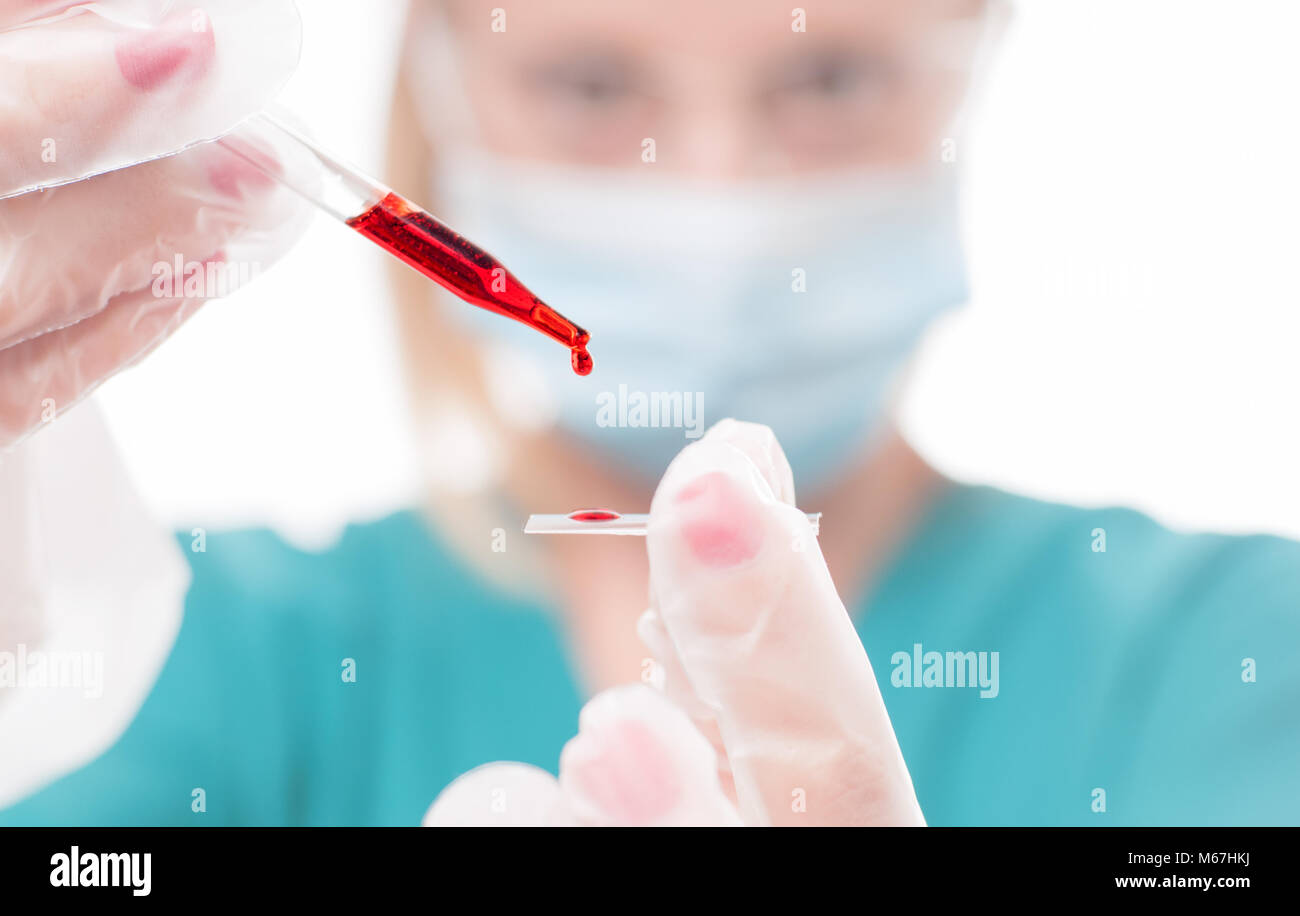 Female doctor doing the blood test in medical laboratory Stock Photo ...