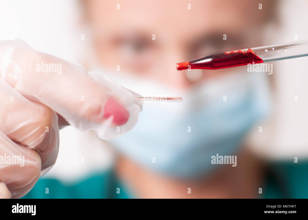 Female doctor doing the blood test in medical laboratory Stock Photo ...