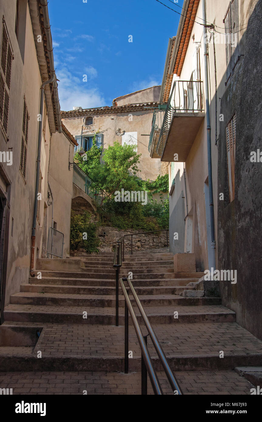 Alley with houses, staircase and handrail at sunset, in the lovely ...