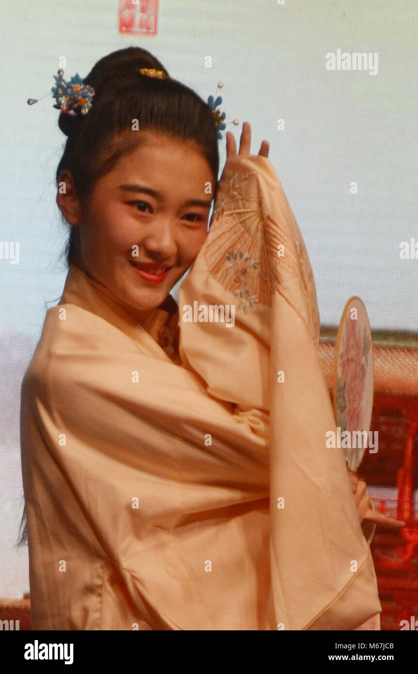 Pakistani and Chinese artist perform on stage wearing traditional ...