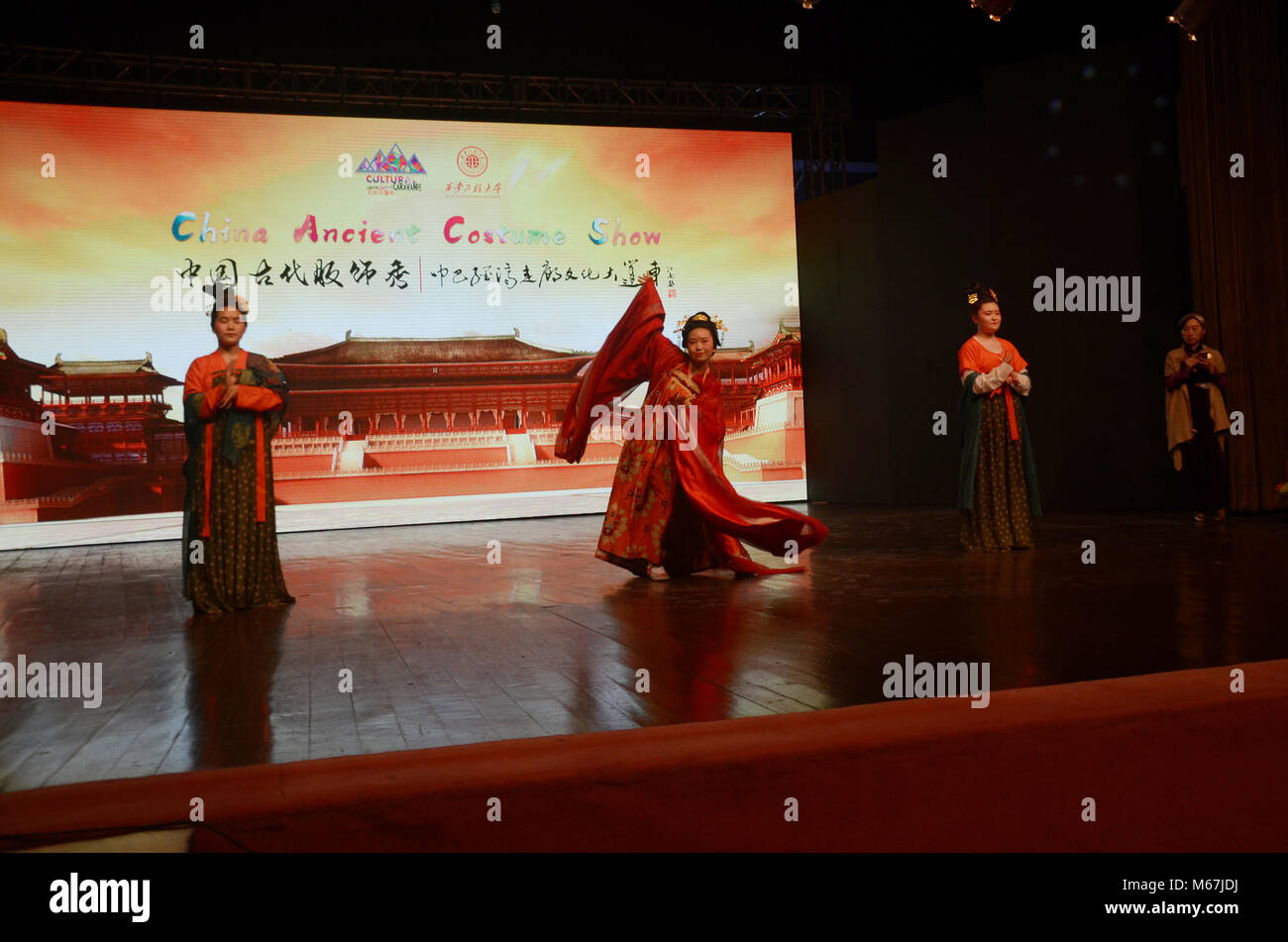 Pakistani and Chinese artist perform on stage wearing traditional ...