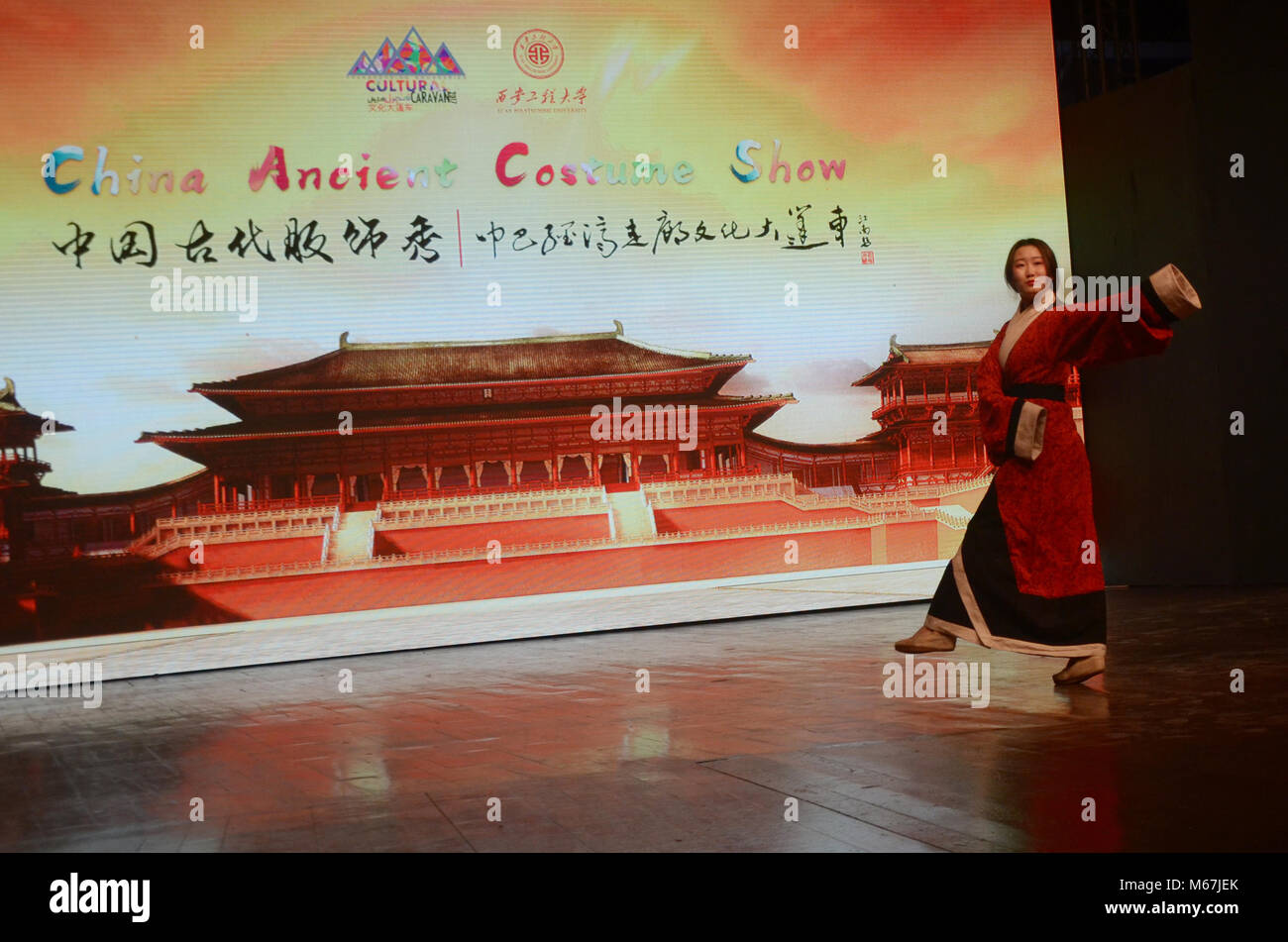 Pakistani and Chinese artist perform on stage wearing traditional ...