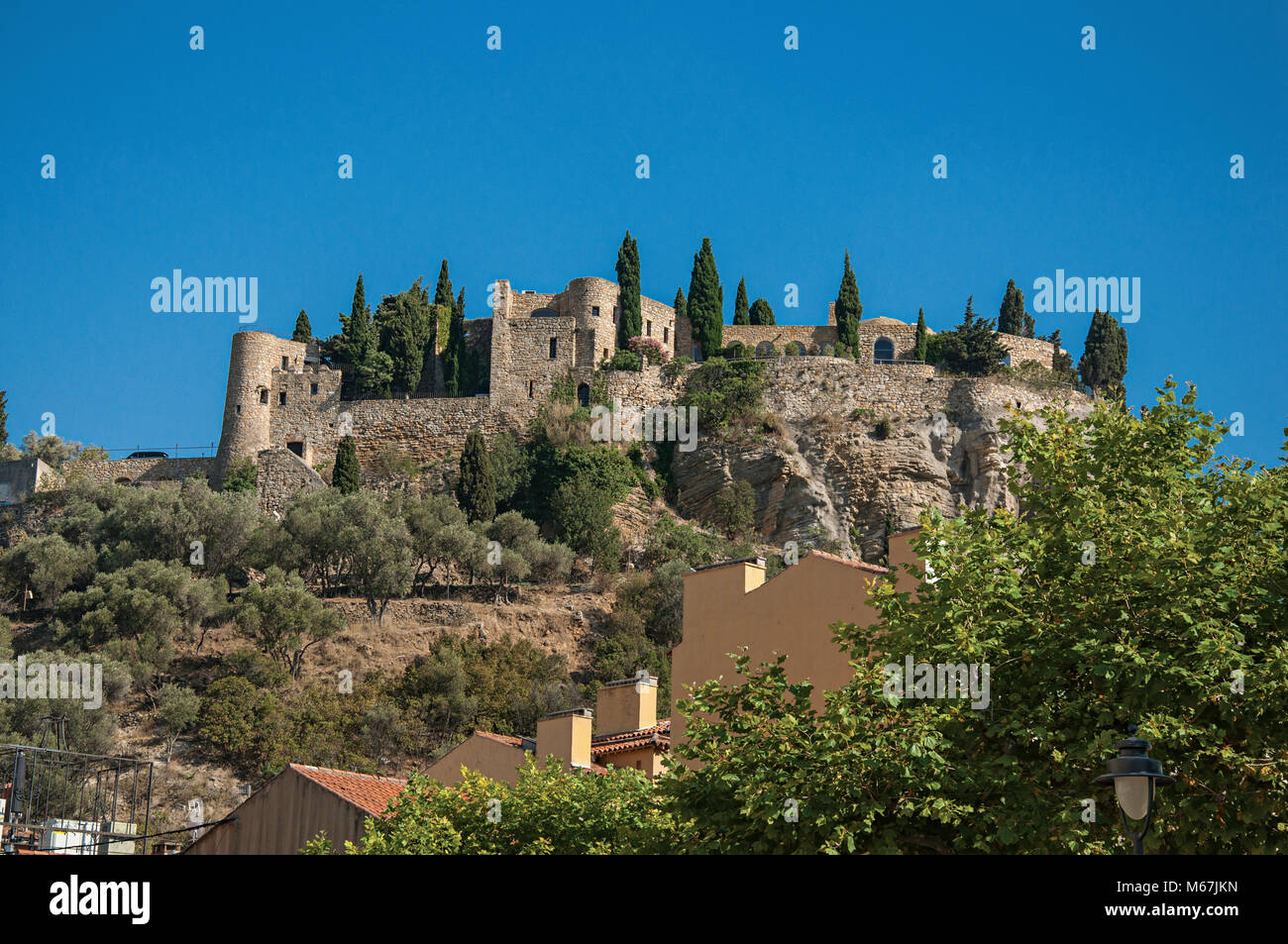 View of castle on top of a hill near the city center of Cassis, a ...