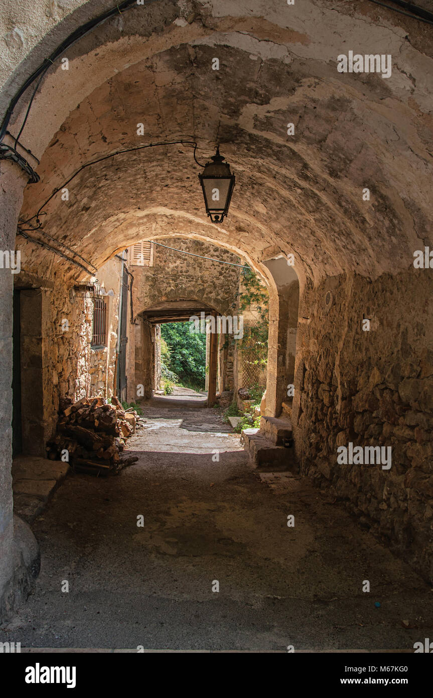 Pedestrian walkway arches under buildings in Chateaudouble, a quiet ...