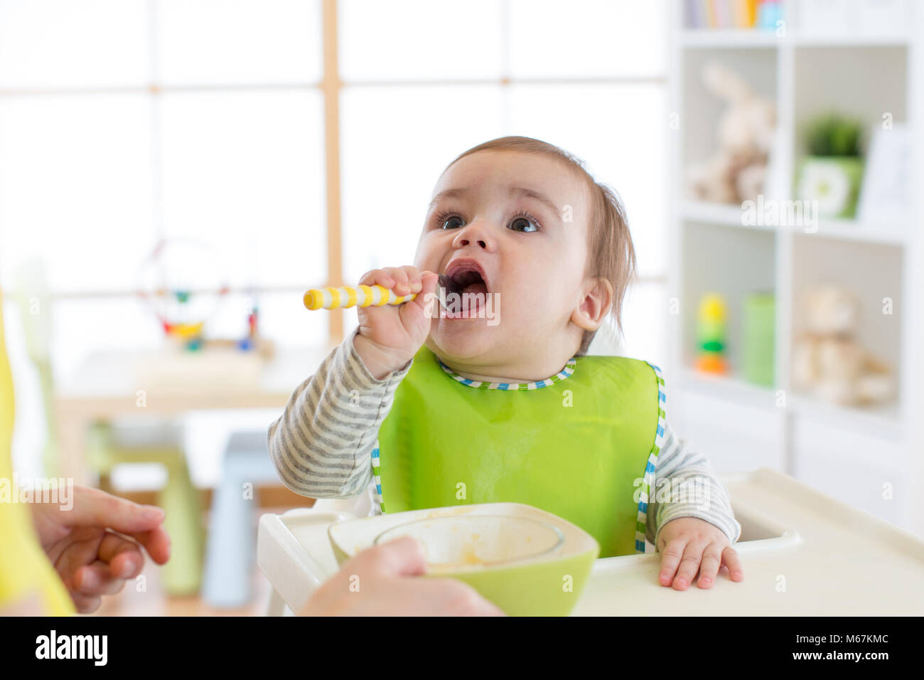 baby eating food Stock Photo - Alamy
