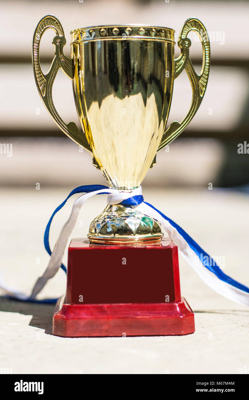 Golden trophy isolated Stock Photo - Alamy