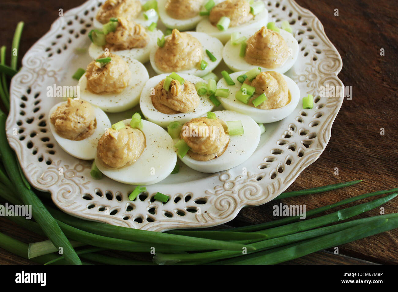 Deviled Eggs With Cod Livers With Leek On White Plate Rustic Wooden 7490