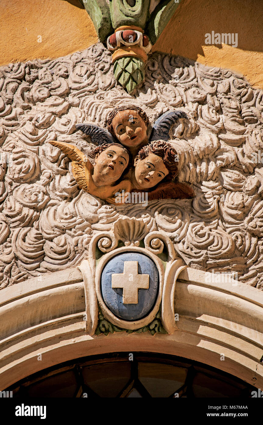 View of sculpture of faces of angels on church facade of Vence, a ...