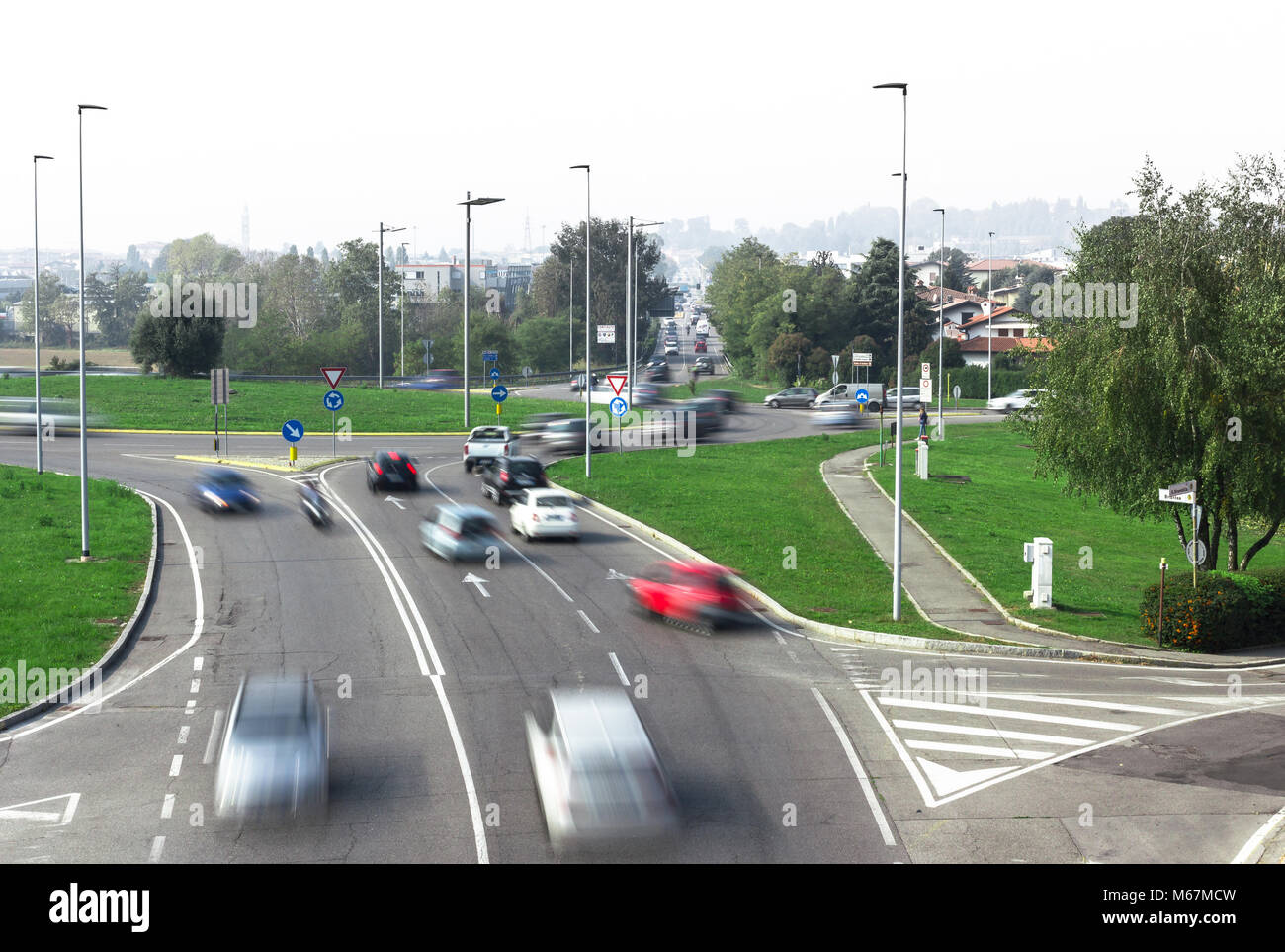 Road traffic at roundabout junction Stock Photo - Alamy