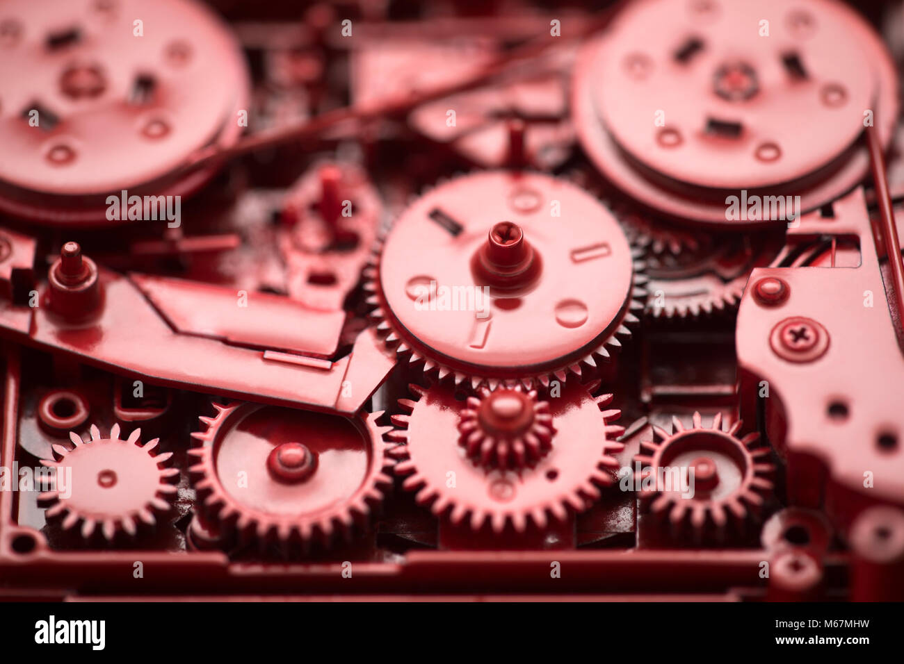 Red gears and cogs macro shot, industrial background Stock Photo - Alamy