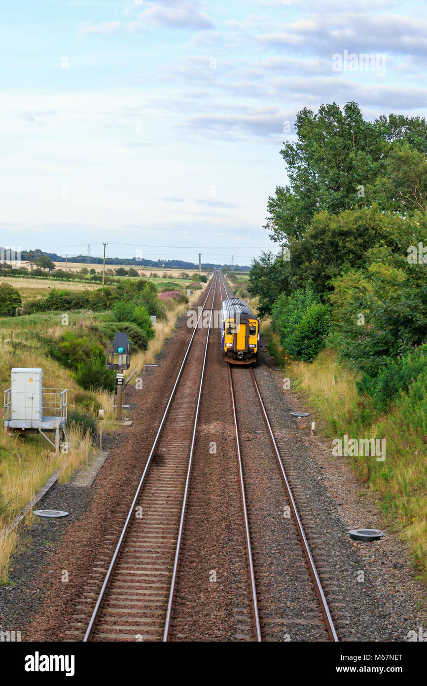Commuter train traveling through the Scottish countryside Stock Photo ...