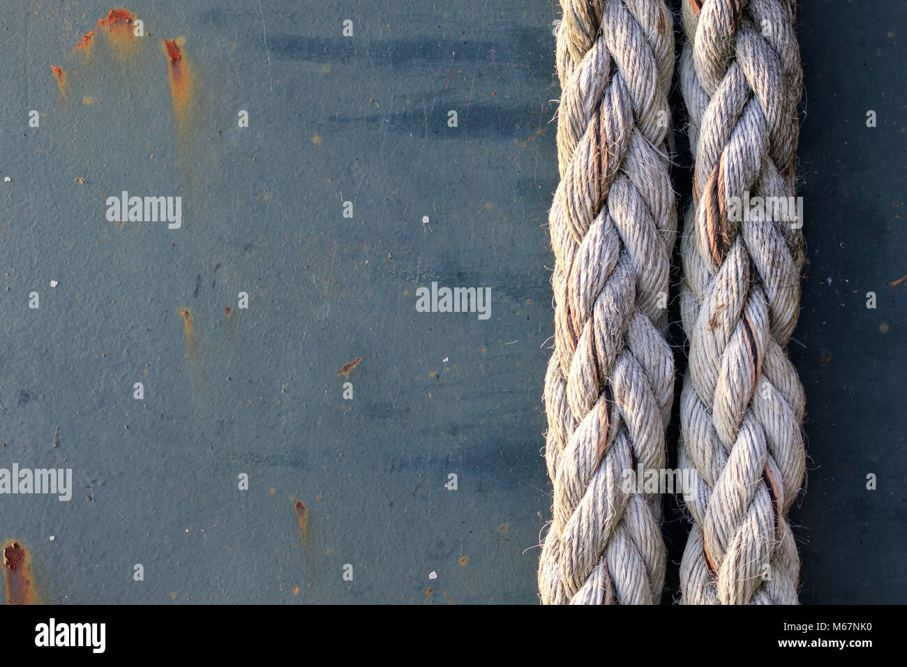 Close up on weathered ship's ropes Stock Photo - Alamy